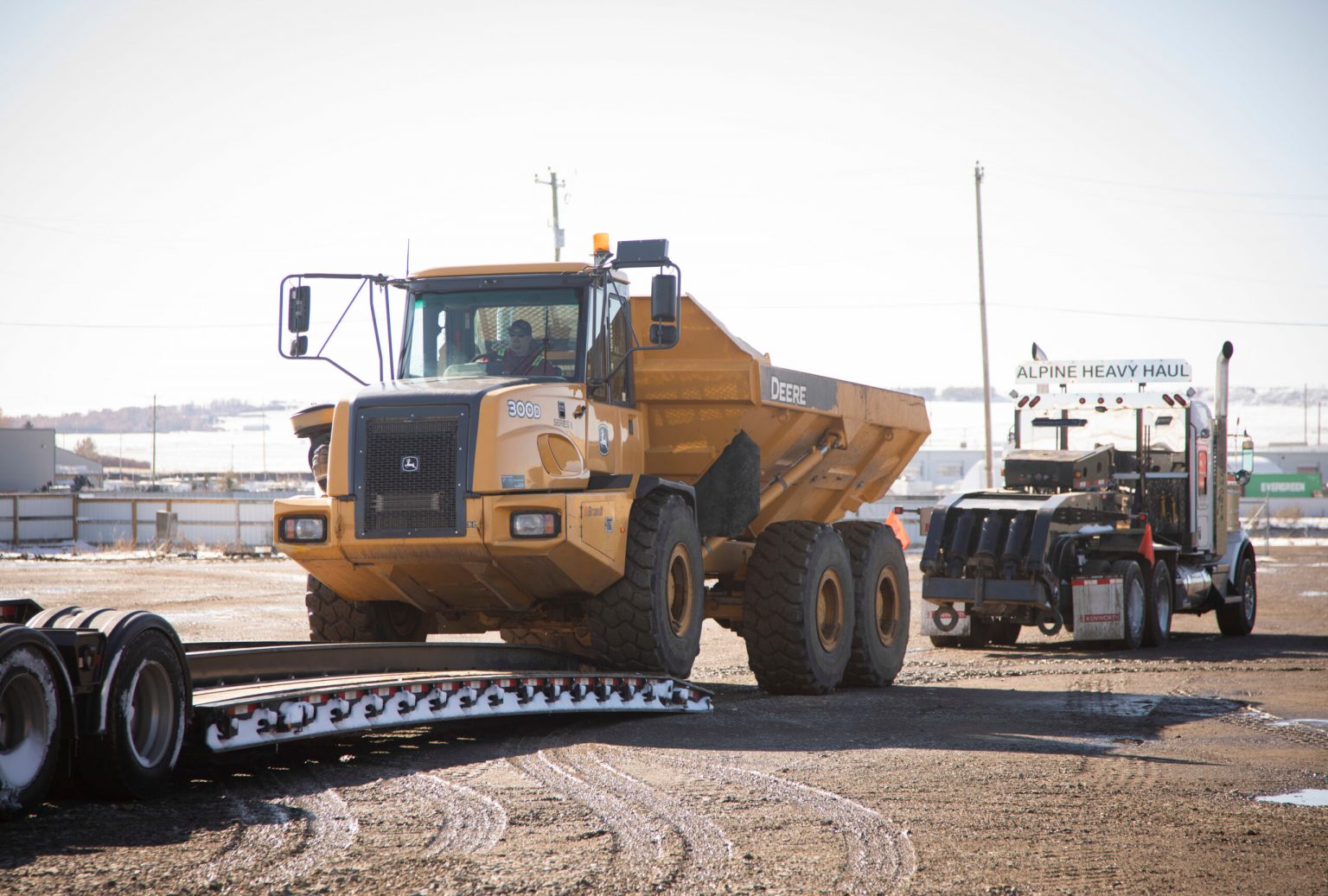 How to Load Heavy Equipment Onto a Trailer - Trusted Dispatch