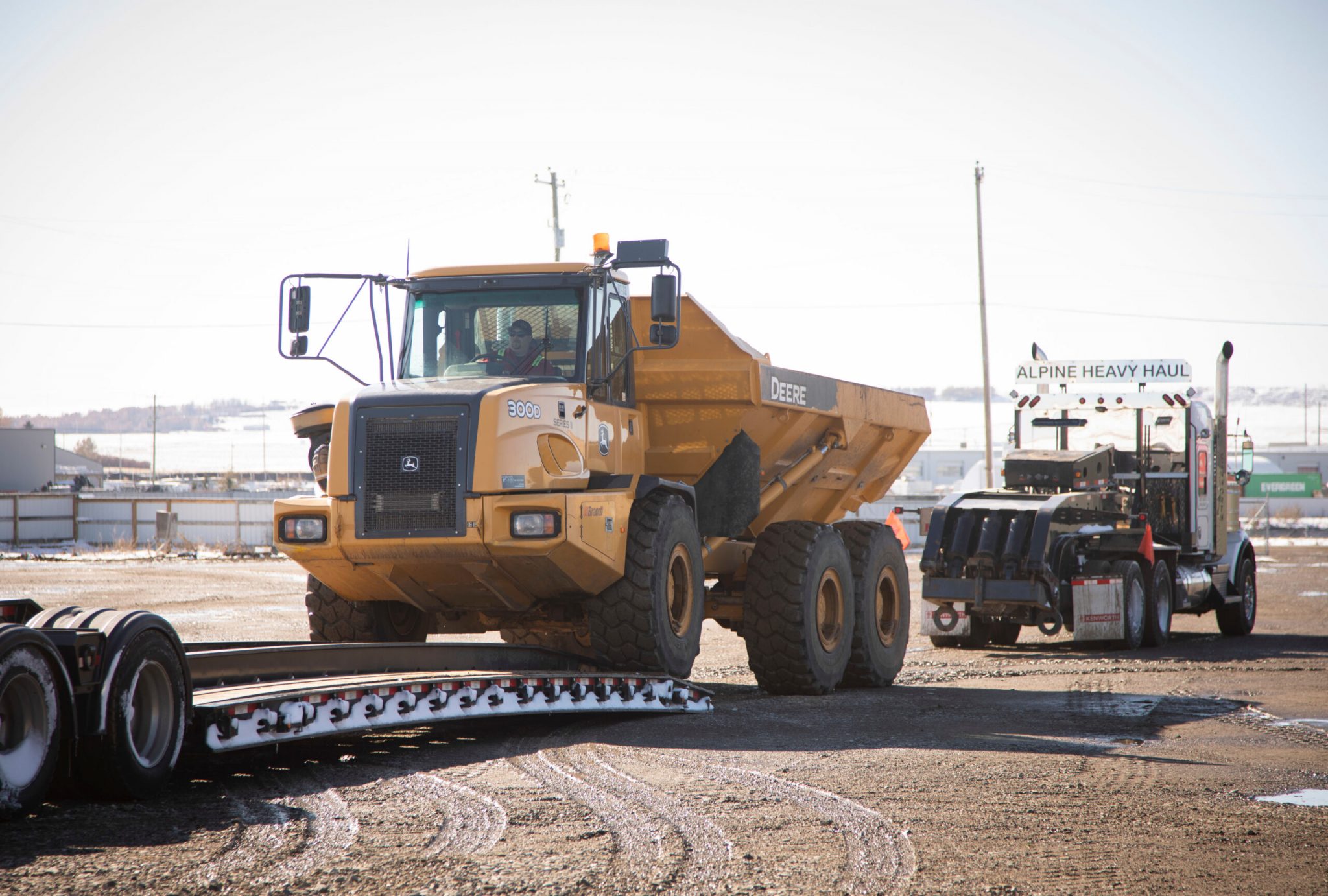 How to Load Heavy Equipment Onto a Trailer - Trusted Dispatch